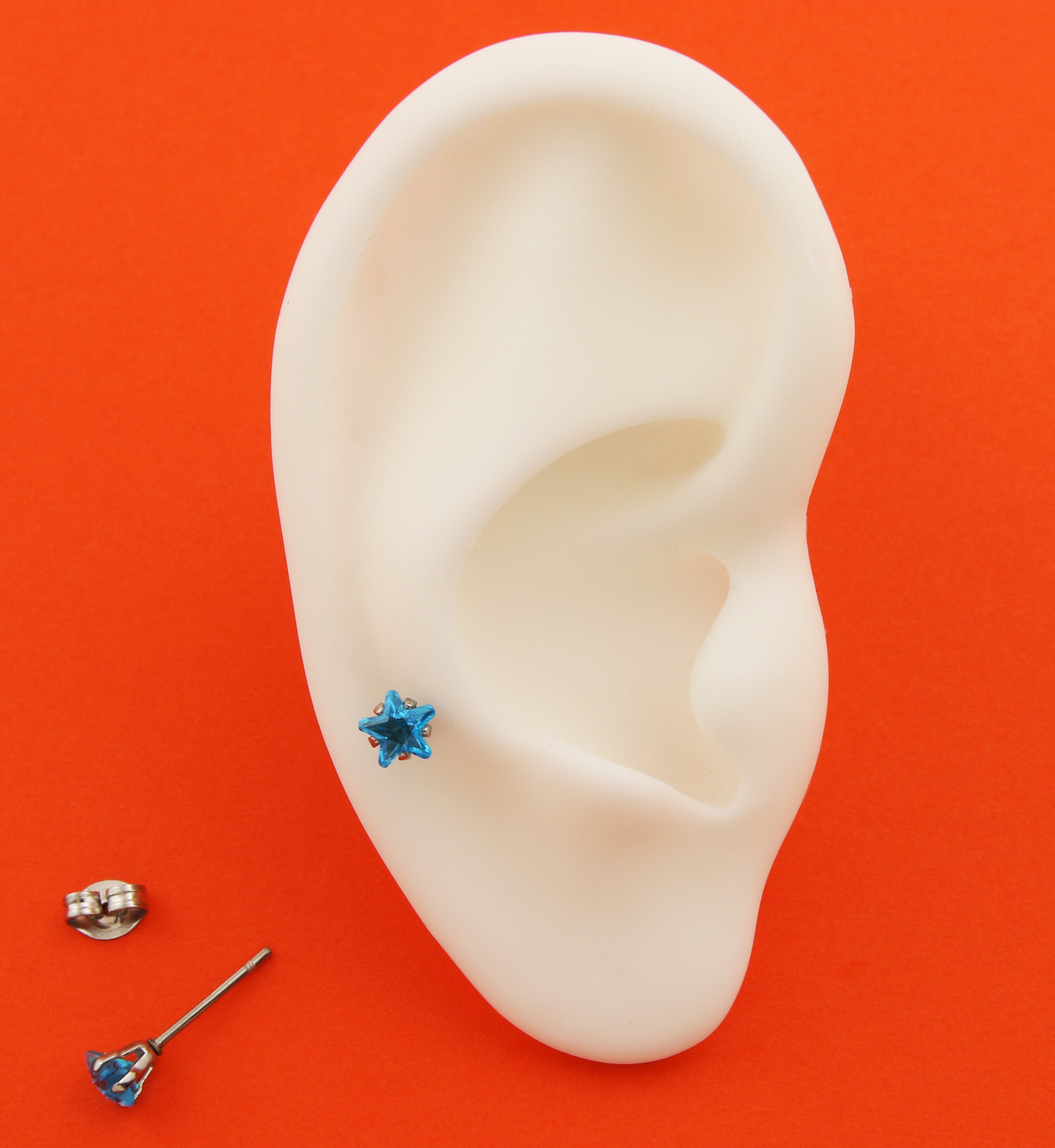 Prong Star Aqua CZ Stainless Steel Stud Earrings | UrbanBodyJewelry.com