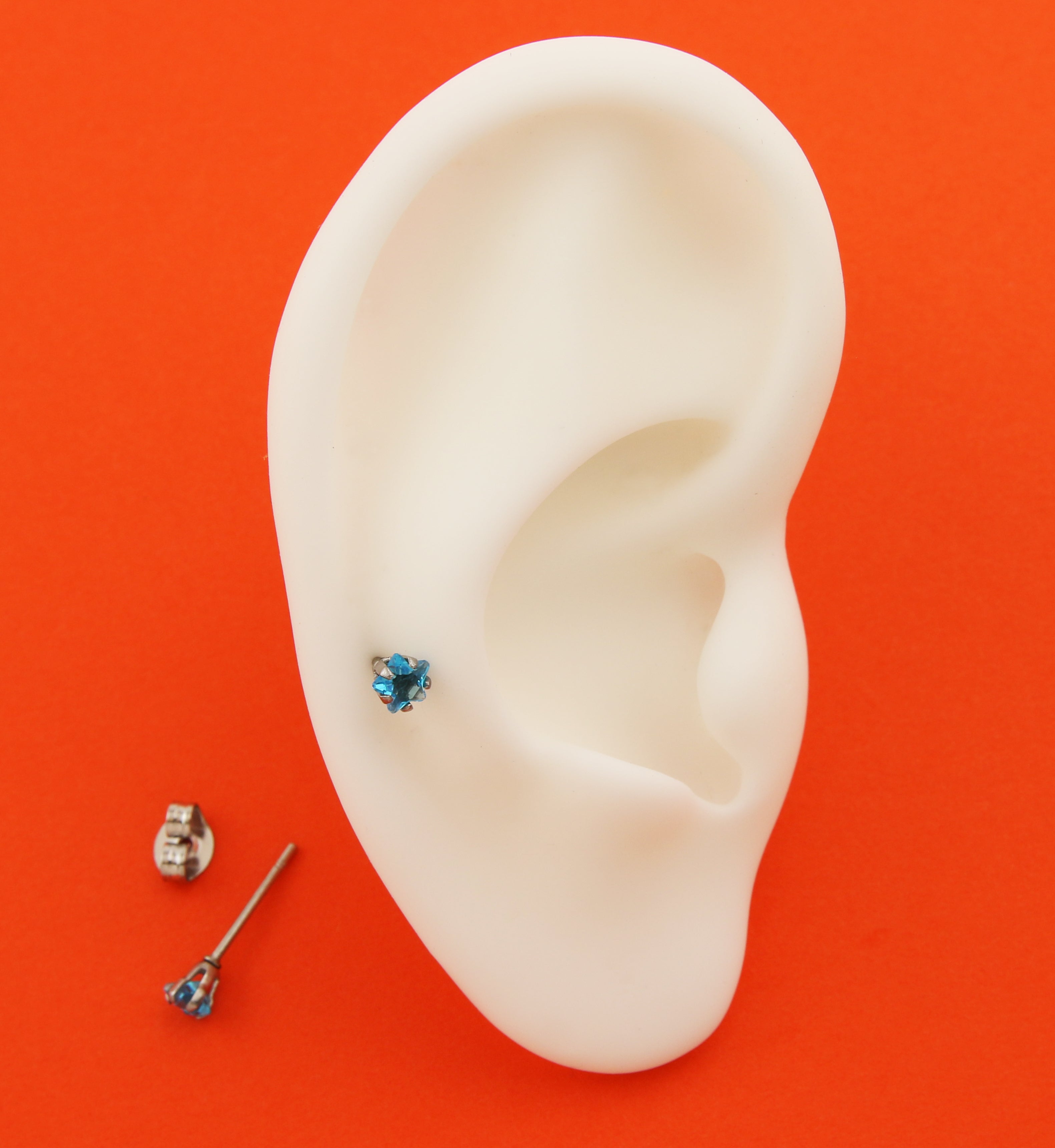 Prong Star Aqua CZ Stainless Steel Stud Earrings | UrbanBodyJewelry.com